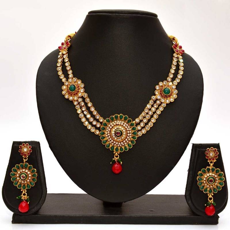 Avni's floral design necklace and earrings studded with white stones ...