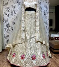 gold embroidered satin semi stitched bridal lehengas - survauttam ...