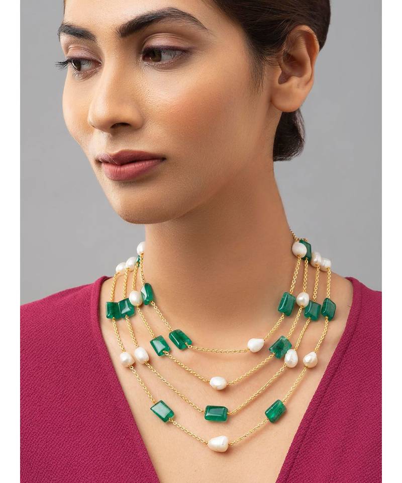 Multi-colored, multi-layered necklace sporting gold plated chain and ...